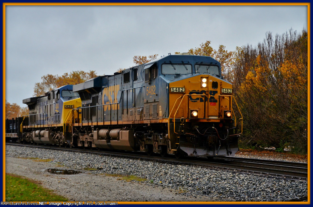 CSX 5482 fronts the loaded slab train west.
